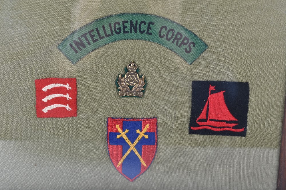 WW2 Intelligence Corp Badge Grouping, framed display of badges relating ...