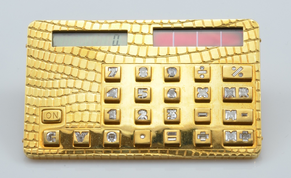 A possibly unique 18ct yellow gold and diamond set calculator, each ...