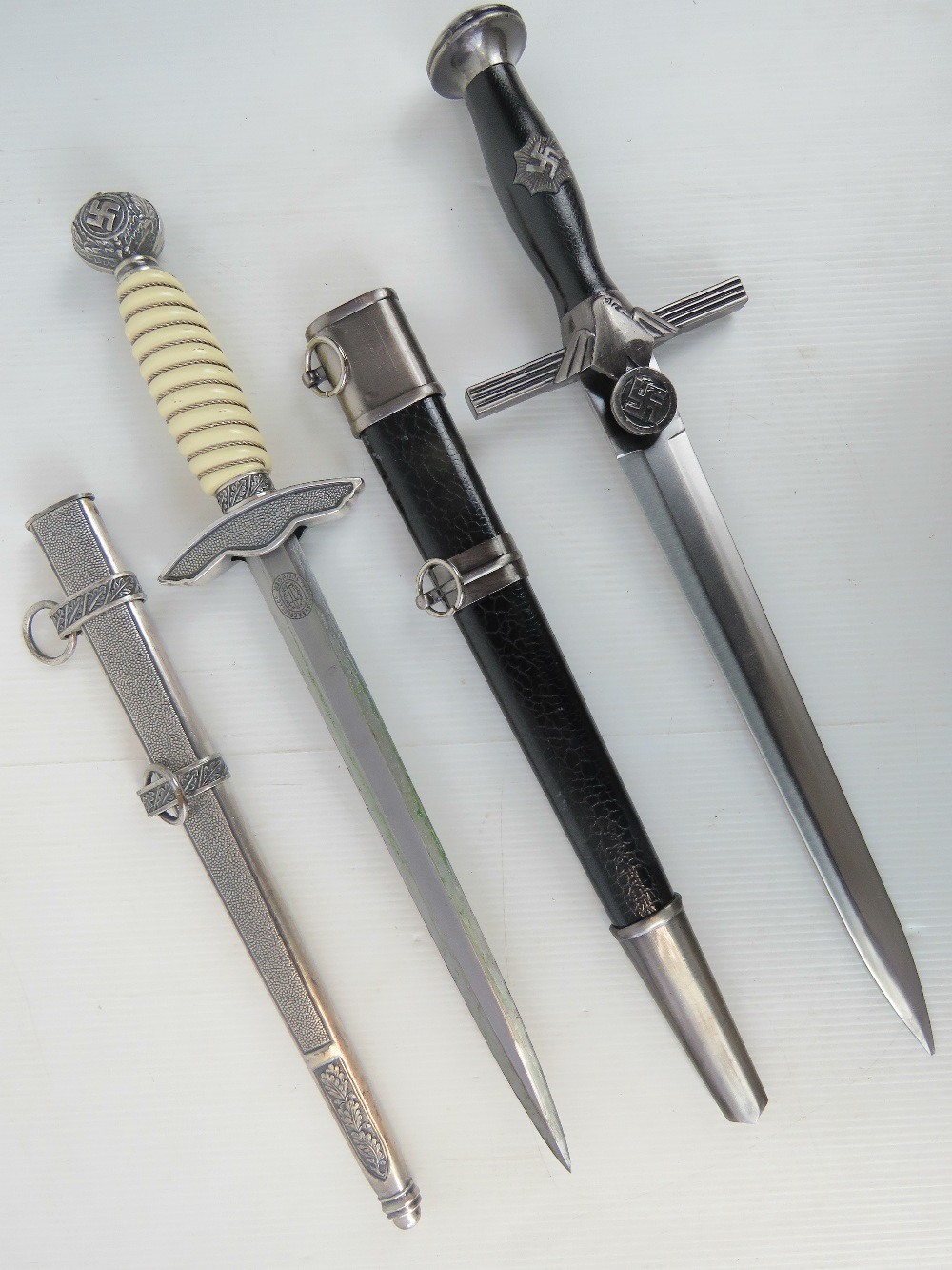 Two reproduction WWII German daggers.