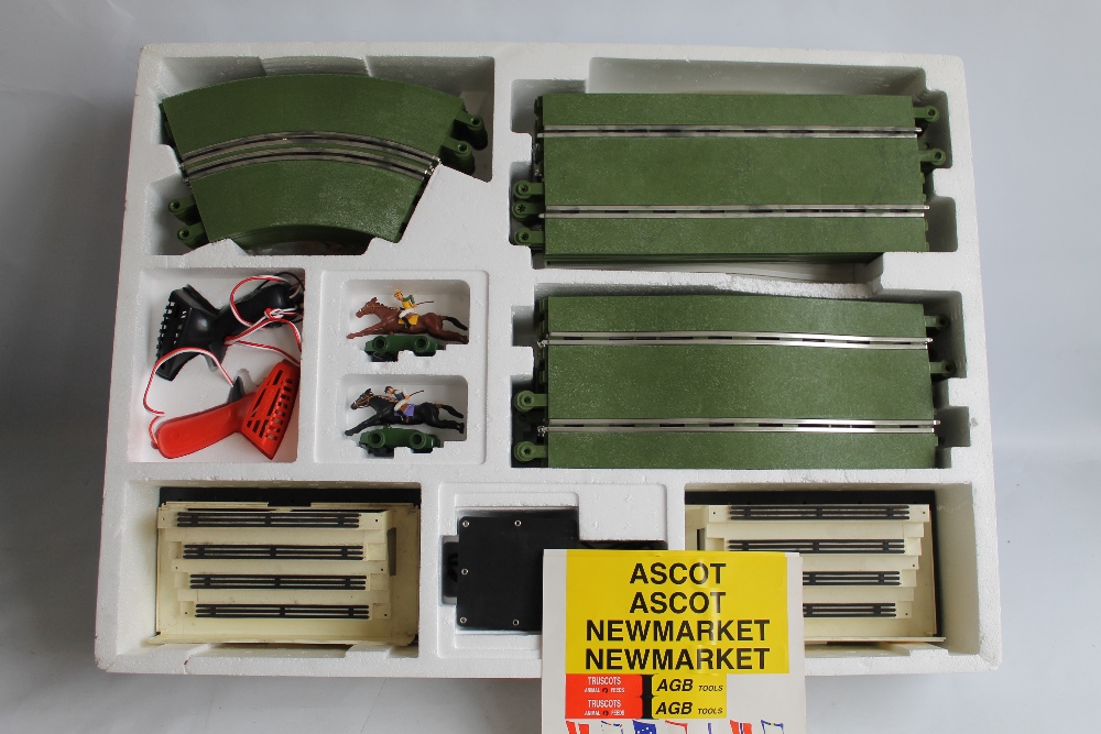A BOXED SCALEXTRIC 'NEWMARKET' UPSTARTS HORSE RACING SET together with ...