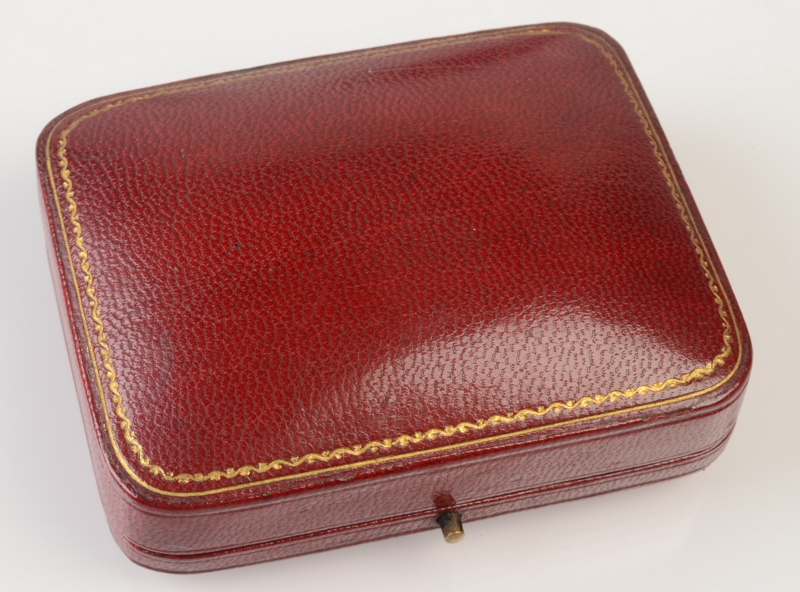 A Garrard gilt red leather jewellery box.