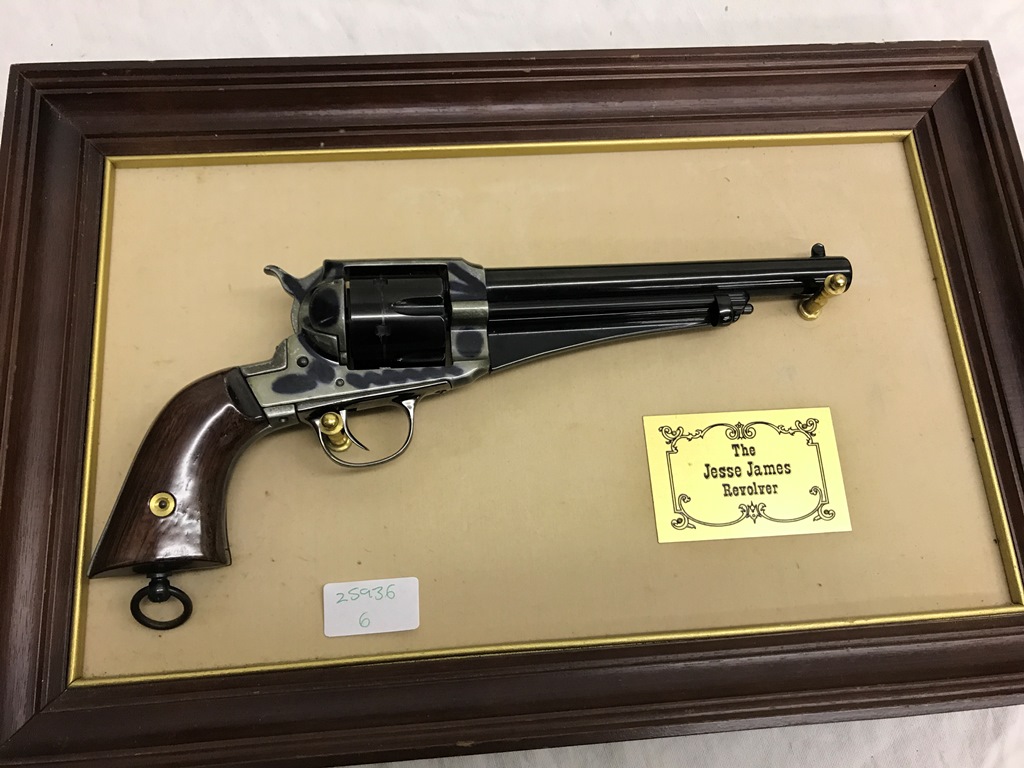 A plaque mounted replica of "The Jesse James Revolver"