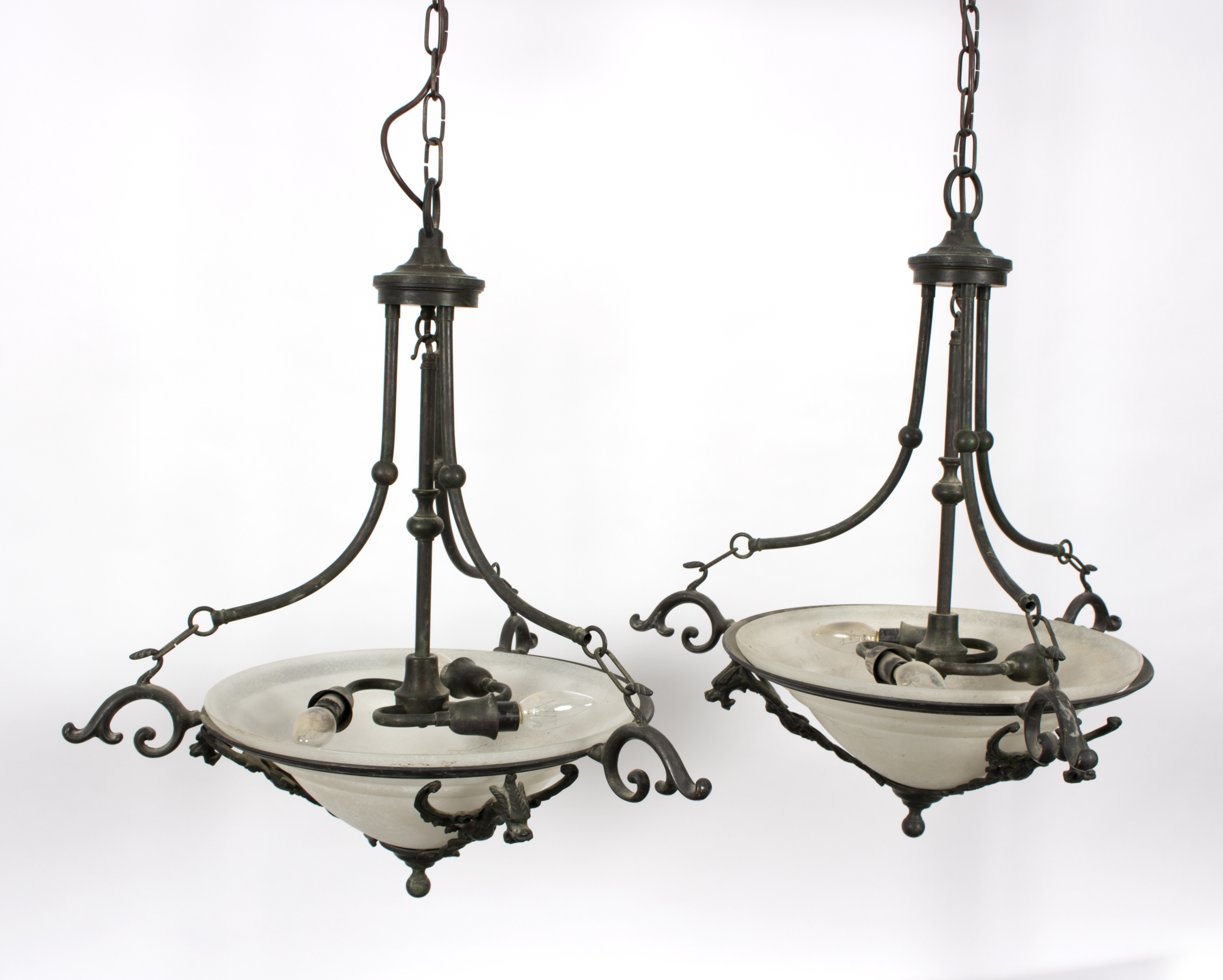 A pair of Christopher Wray bronzed metal and glass ceiling lights, the ...