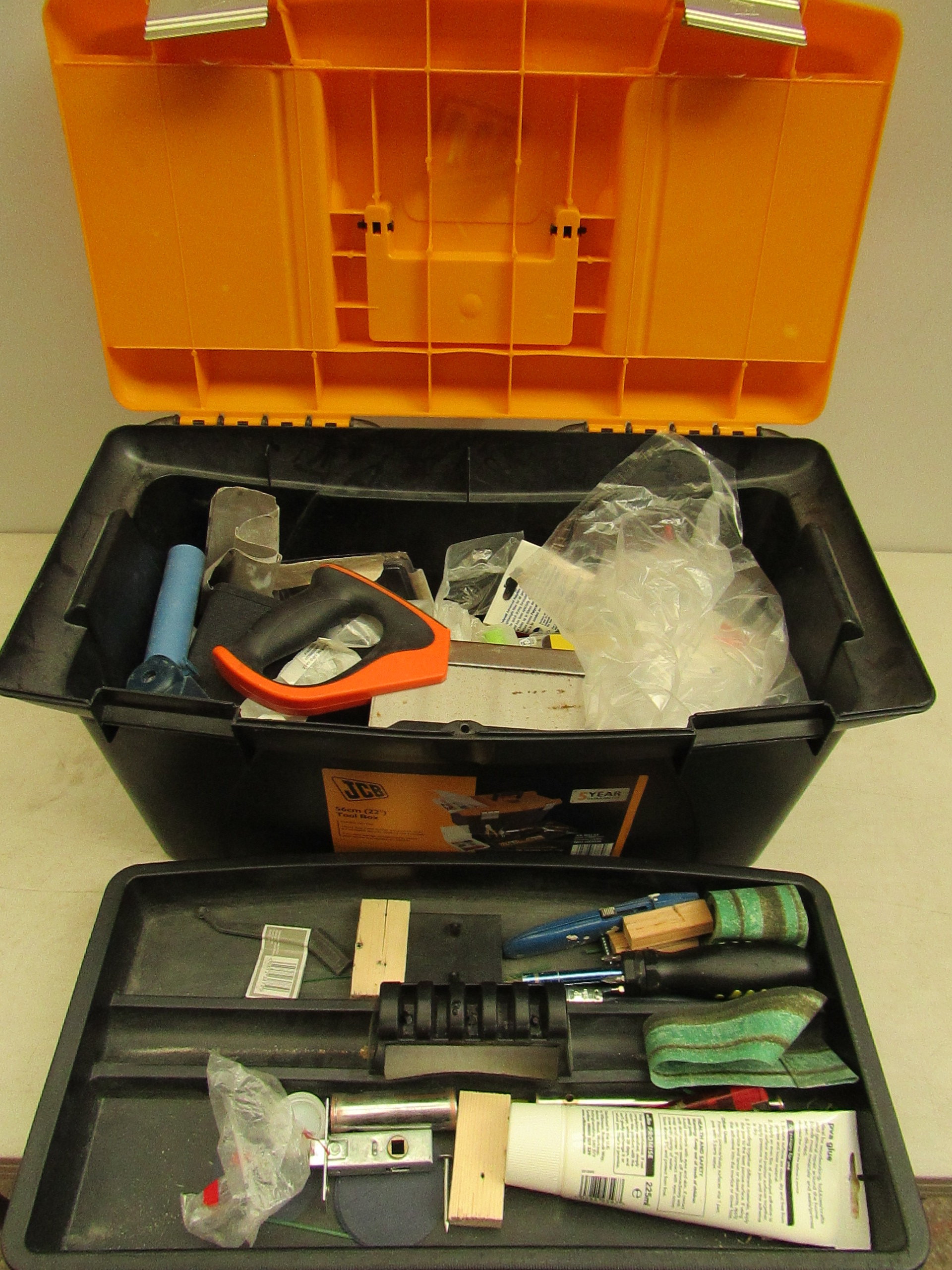 JCB 56cm (22") Tool box, contains a variety of tools.