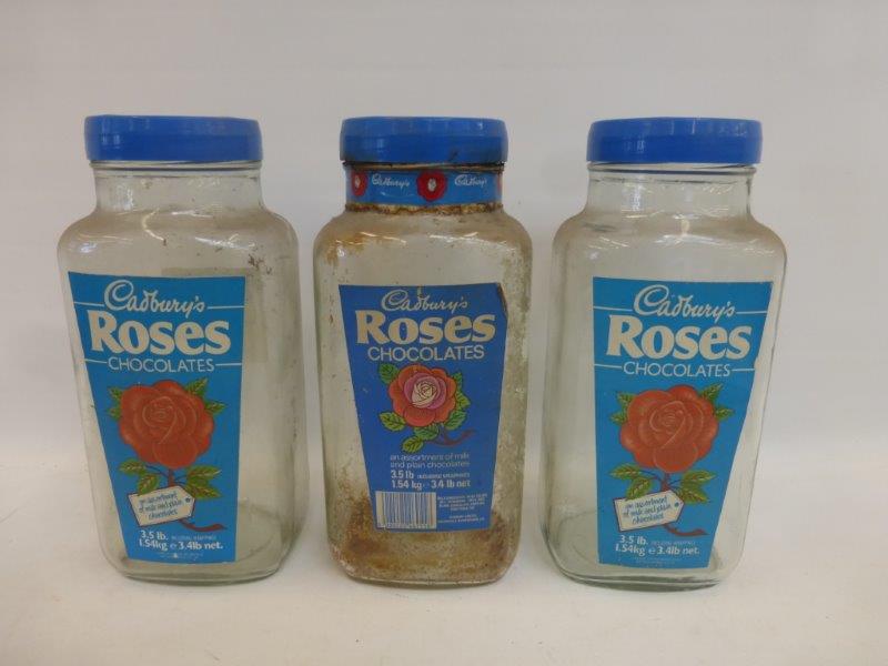 Three Cadbury's Roses Chocolates glass sweetie jars.