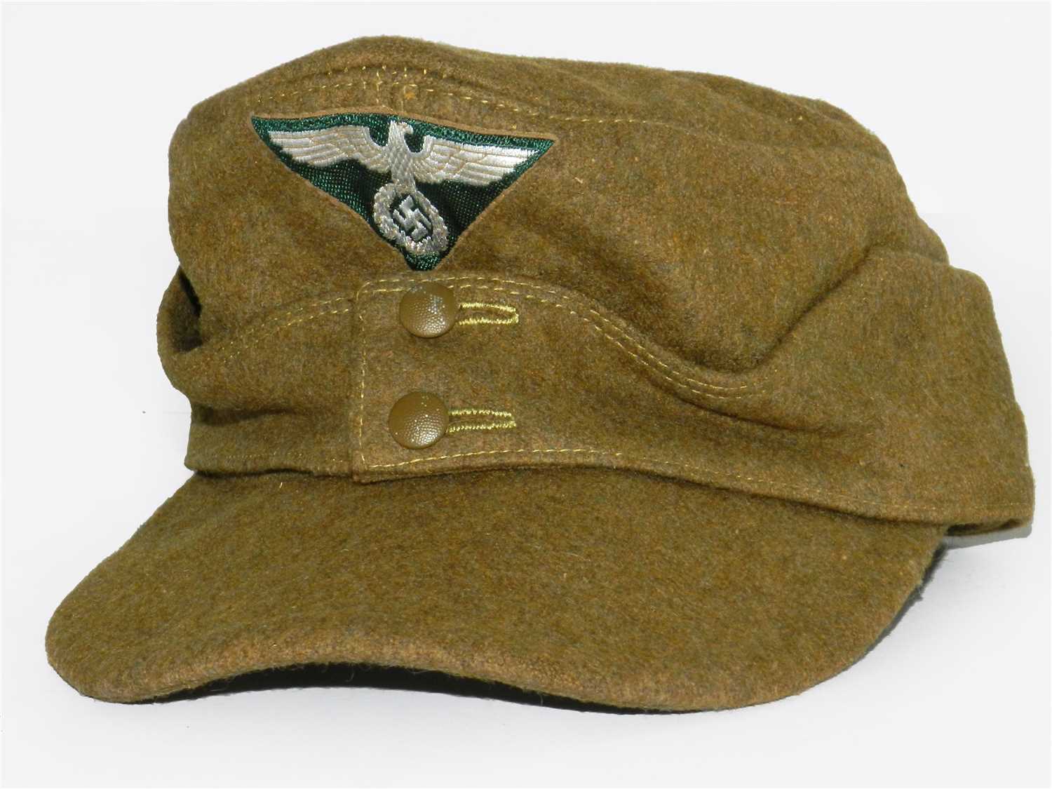 A German Third Reich SA M43 Field/Ski cap constructed of woollen body ...