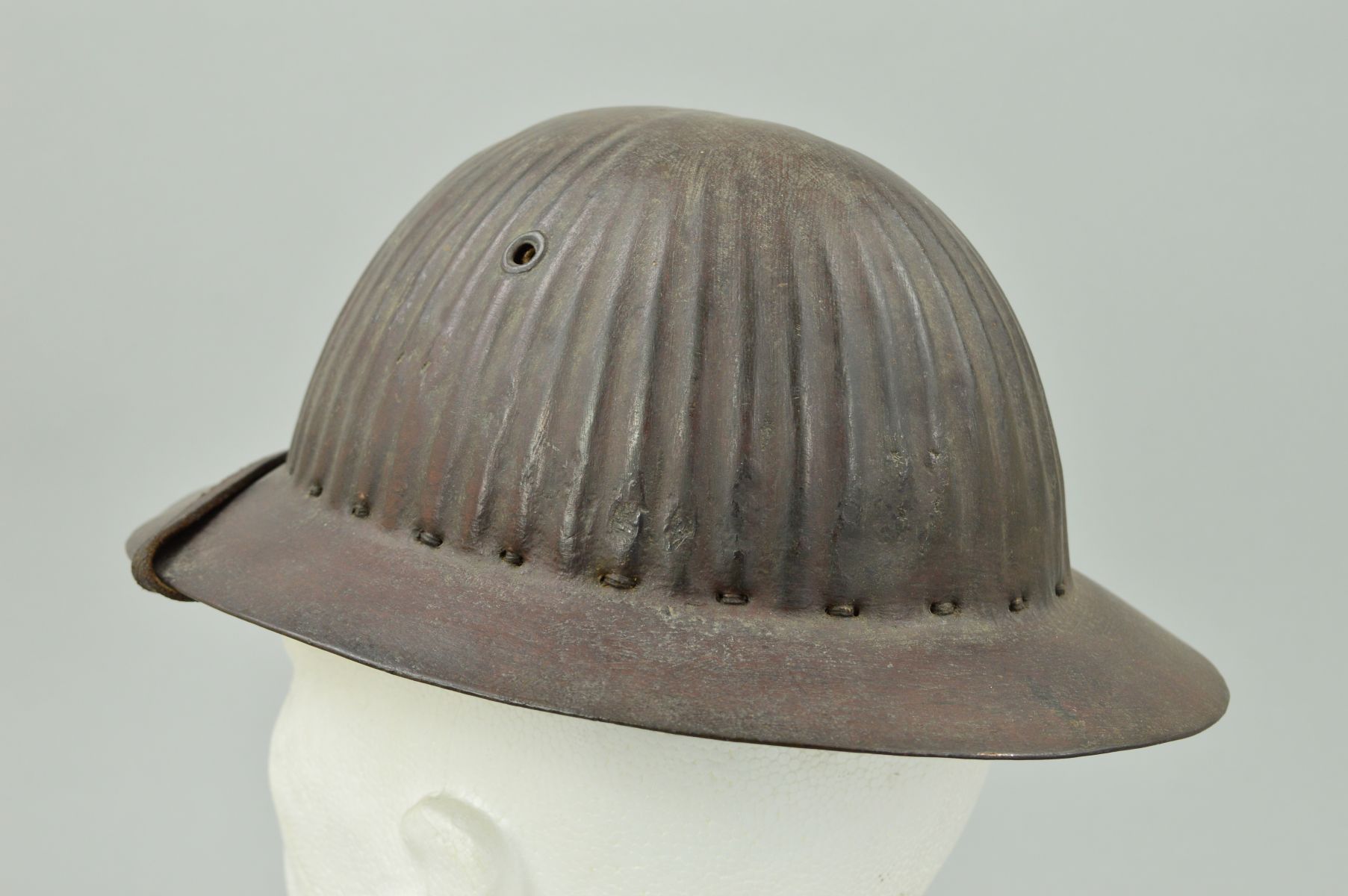 A WWI ERA, EARLY ISSUE BRODIE STYLE HELMET, which is believed to have ...