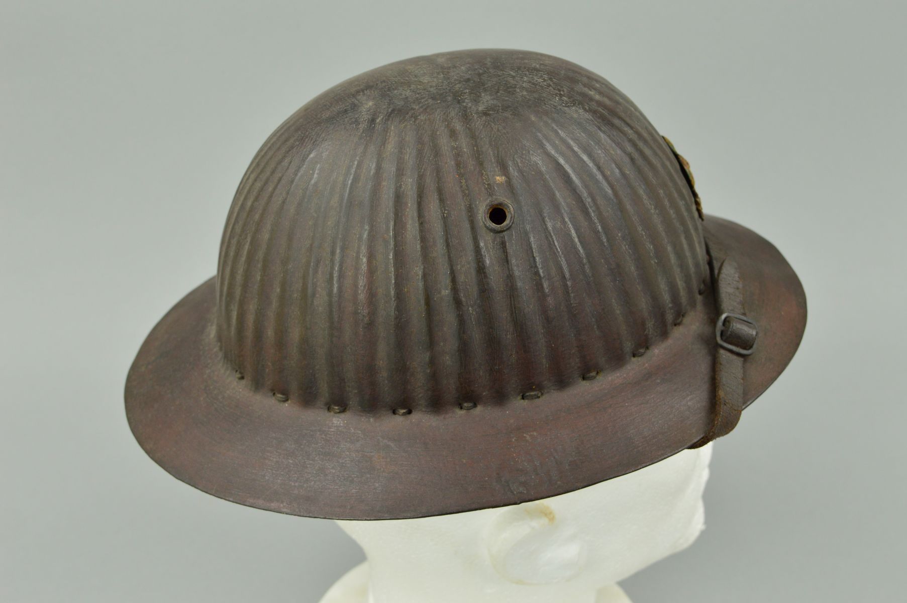 A WWI ERA, EARLY ISSUE BRODIE STYLE HELMET, which is believed to have ...