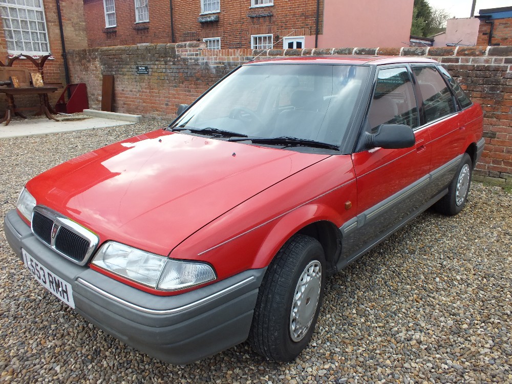 A red four door Rover 218 SLD, hatch back diesel turbo (one previous ...