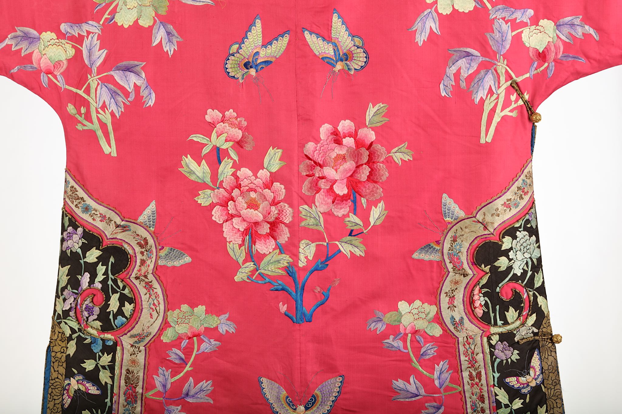 A CHINESE EMBROIDERED SILK LADY’S PINK GROUND ROBE.Late Qing Dynasty ...