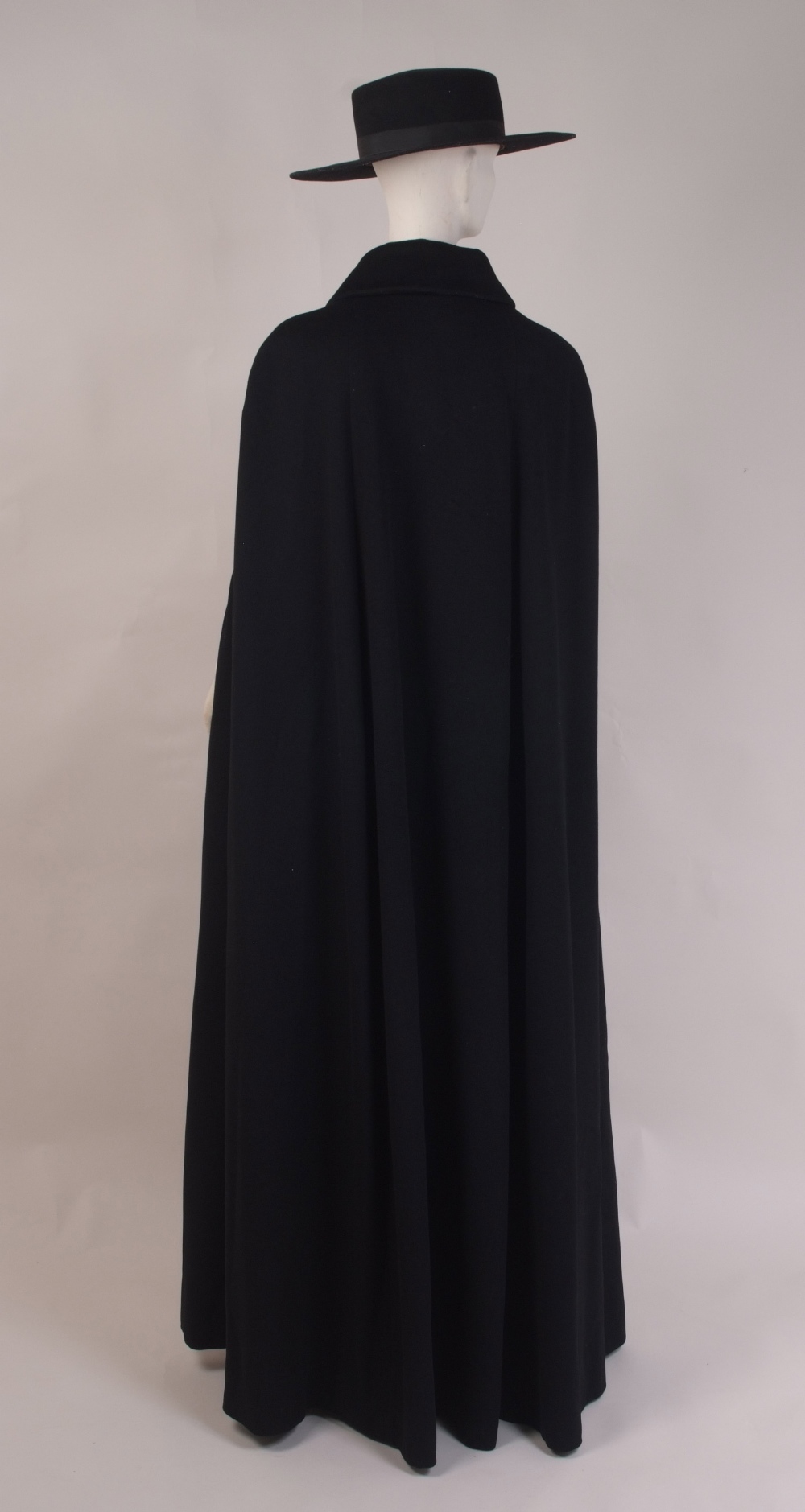 A VINTAGE BLACK WOOL CLOAK & BLACK FELT SPANISH HAT A full length soft ...