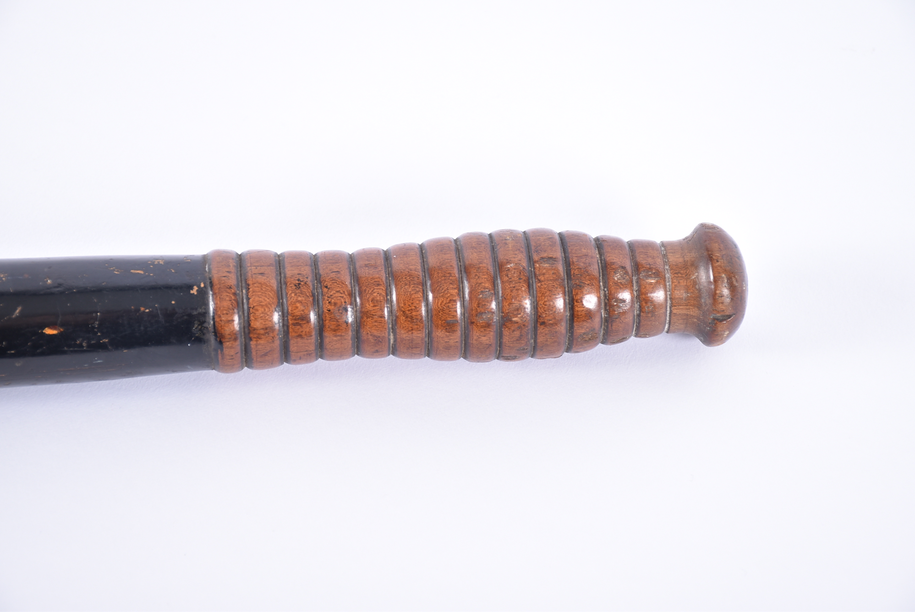 A painted Victorian truncheon decorated with gilt crown, engraved at ...