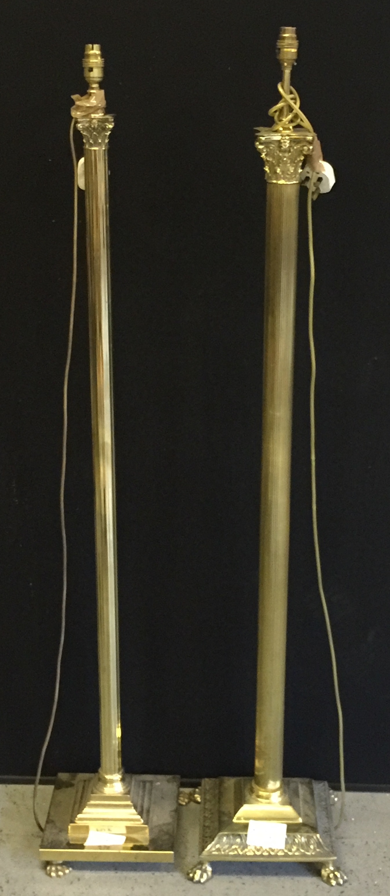 FLOOR LAMPS - pair of pillar form brass floor lamps. Each with claw ...