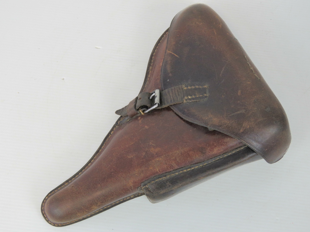 A WWII German Officers brown leather Luger P08 pistol holster, having ...