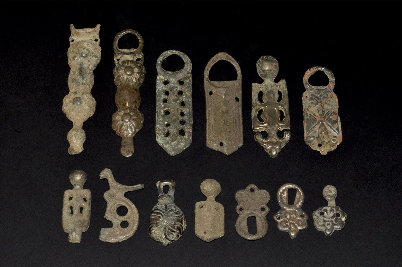 12th-15th century AD. A mixed group of bronze fasteners comprising: six ...