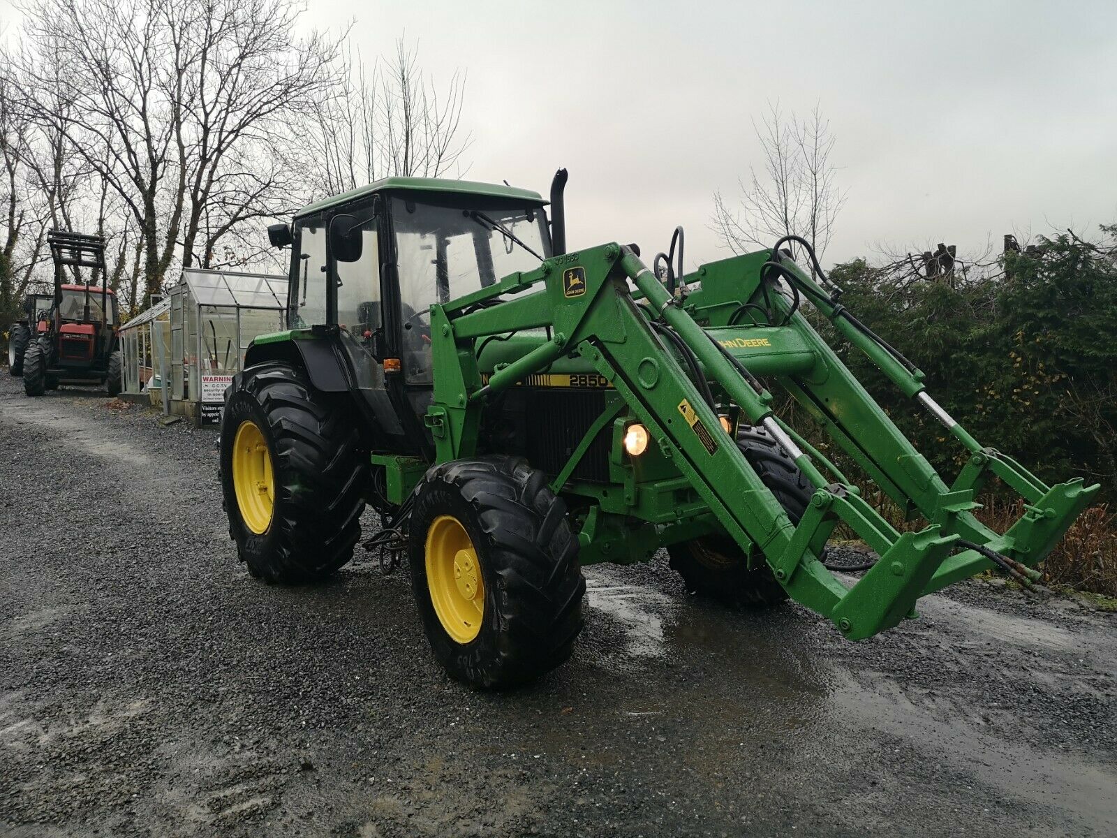 John Deere Tractor 2850 4 wheel drive and loader. The loader is very ...