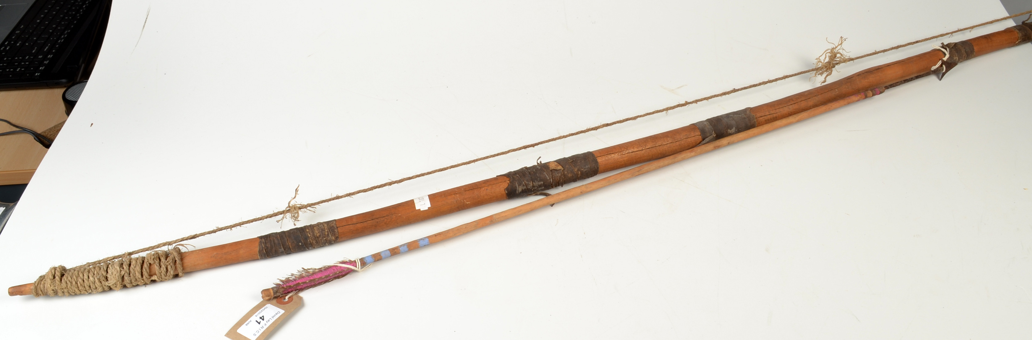 A Tanzania 'Hadza' tribe bow and arrow, length of bow 166cm.