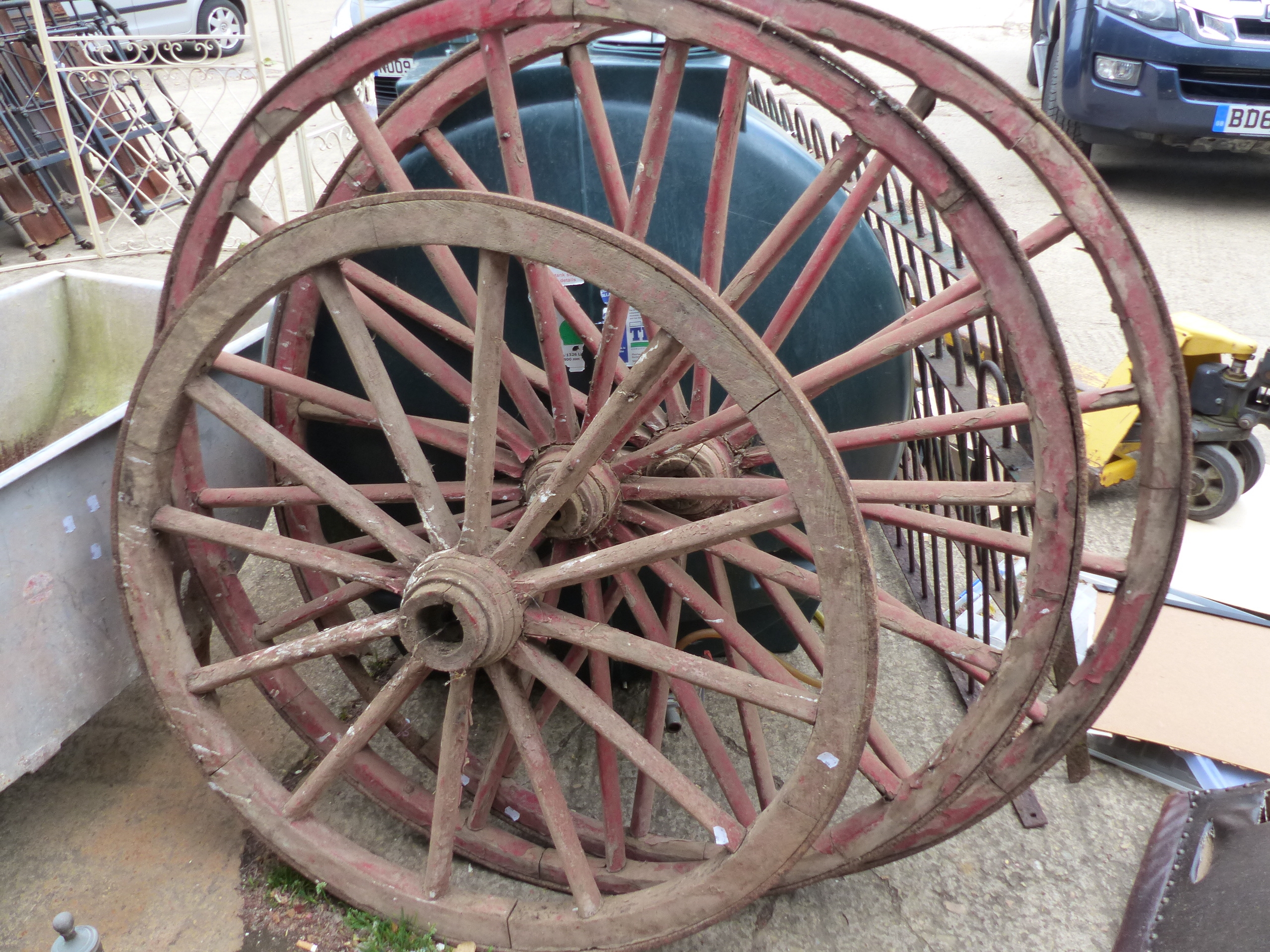 THREE ANTIQUE WAGON/ CART WHEELS.