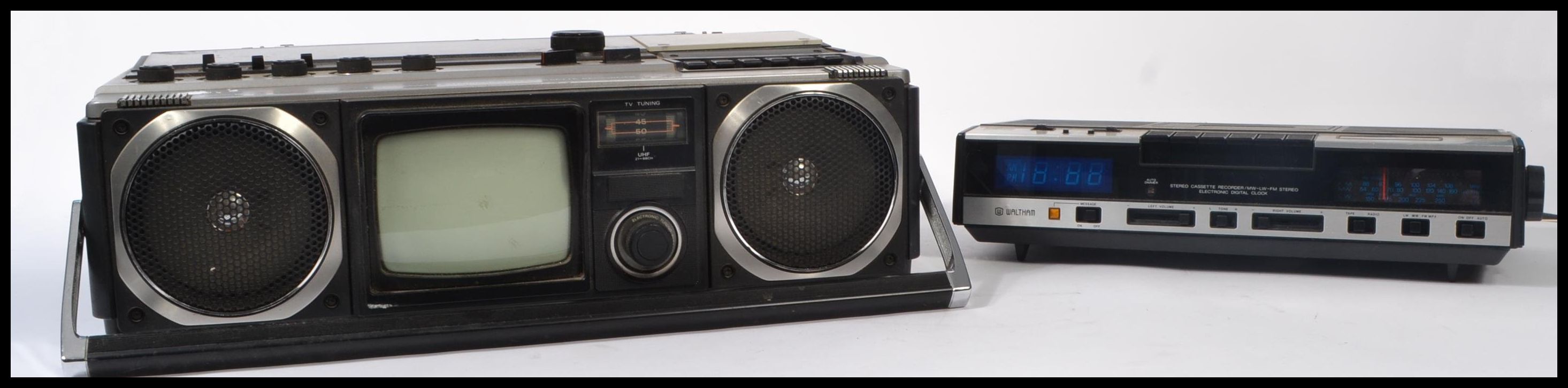 A Hitachi TV FM MW / LW stereo radio cassette recorder along with a ...