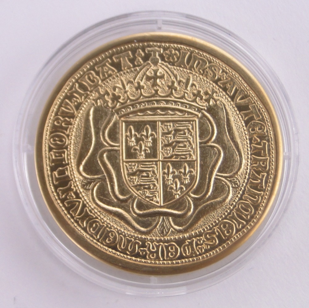 A Henry VII replica gold sovereign,9ct gold, 31.1g, cased.