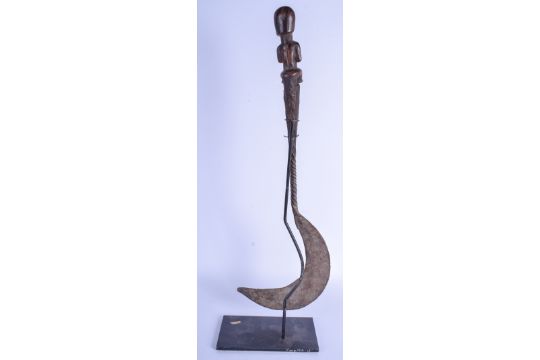 A LARGE 19TH CENTURY AFRICAN TRIBAL CARVED WOOD SCYTHE. 53 cm high.