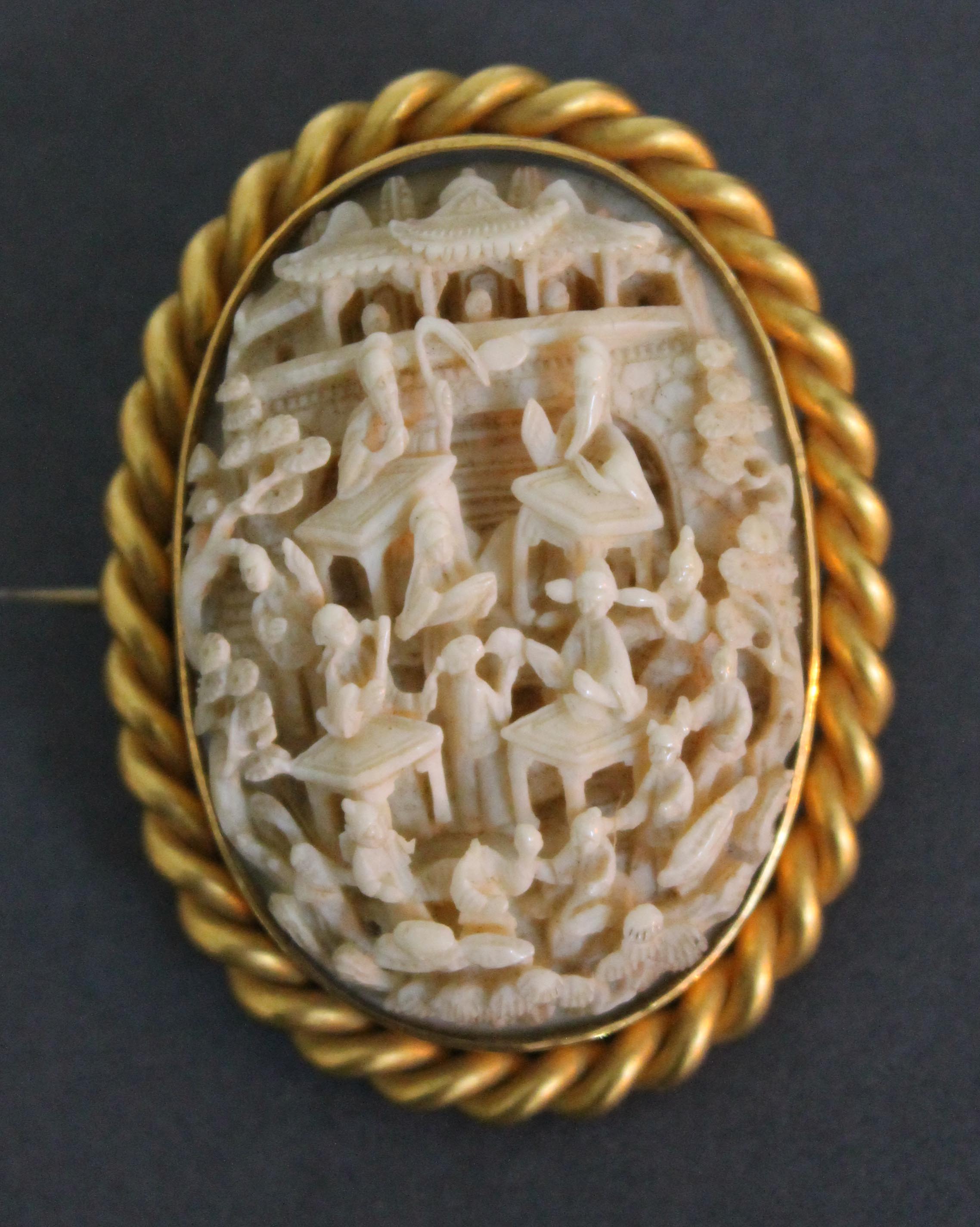 A 19th Century Chinese Canton carved ivory brooch set in twist yellow ...
