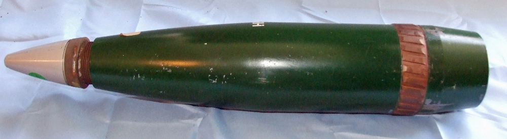 An 105mm Projectile, fired, inert, with nose plug for a 105 mm field ...