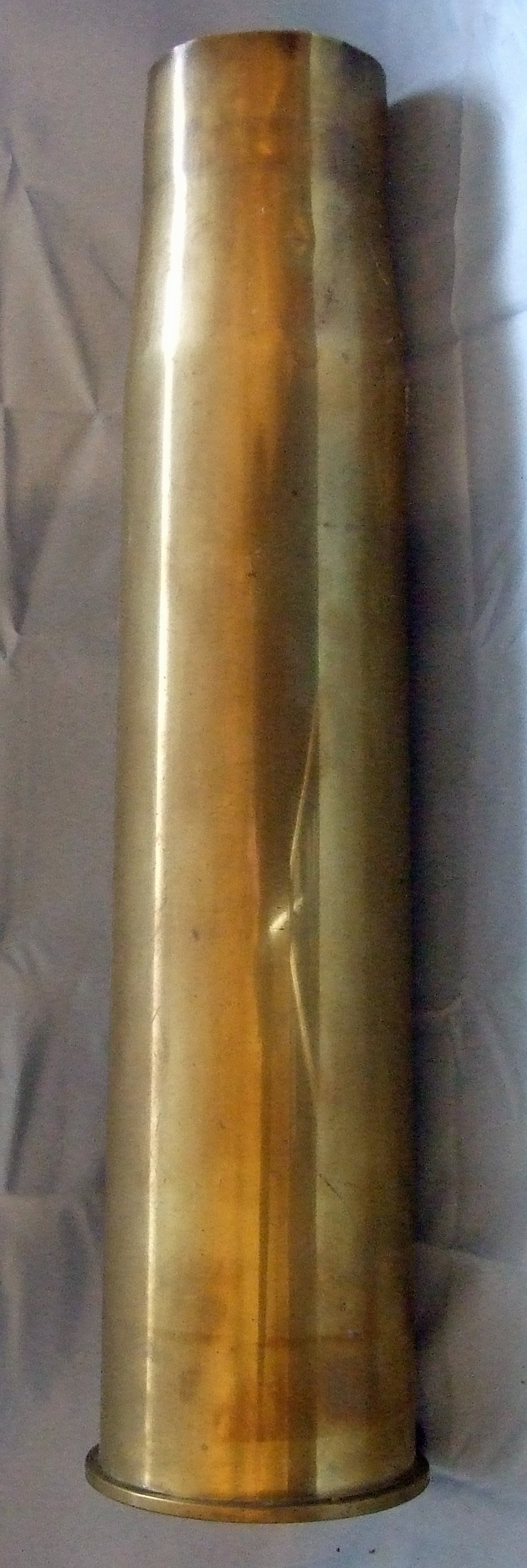 Three 105mm cartridge cases, one for the use in the Howitzer, no primer ...