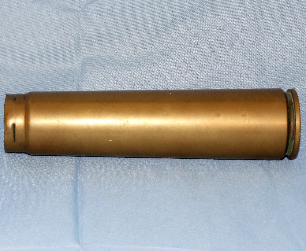 A 105mm British brass cartridge for use in the 105mm Light Gun, with ...