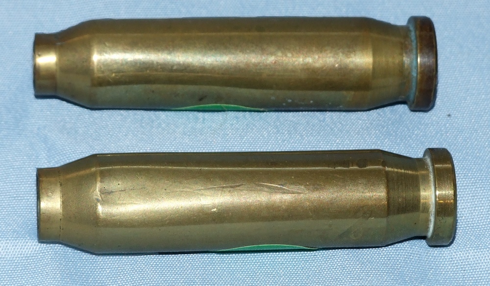 Two primer tubes for 120mm tank ammunition, brass cartridge cases with ...
