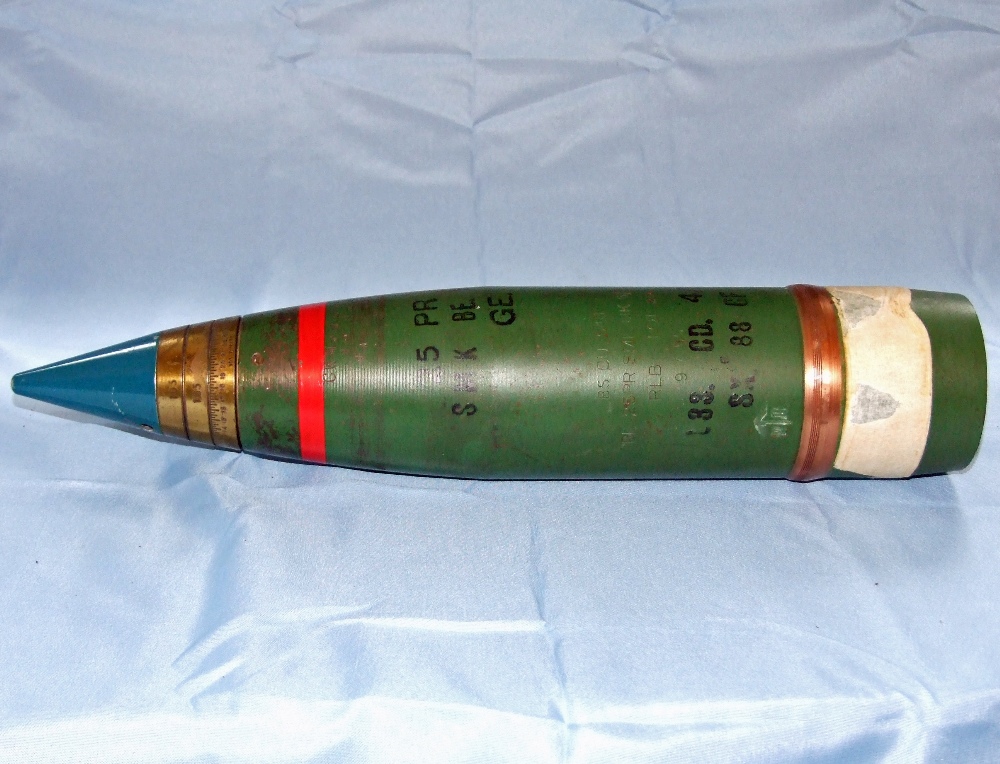 A 25pr unfired smoke base ejection projectile with fuze No. 390 Mk. 3/1 ...