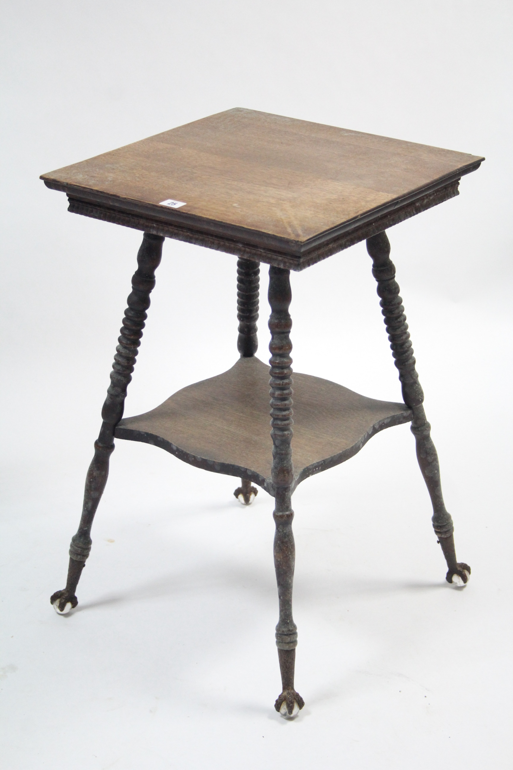 A late 19th century oak square two-tier occasional table on bobbin ...