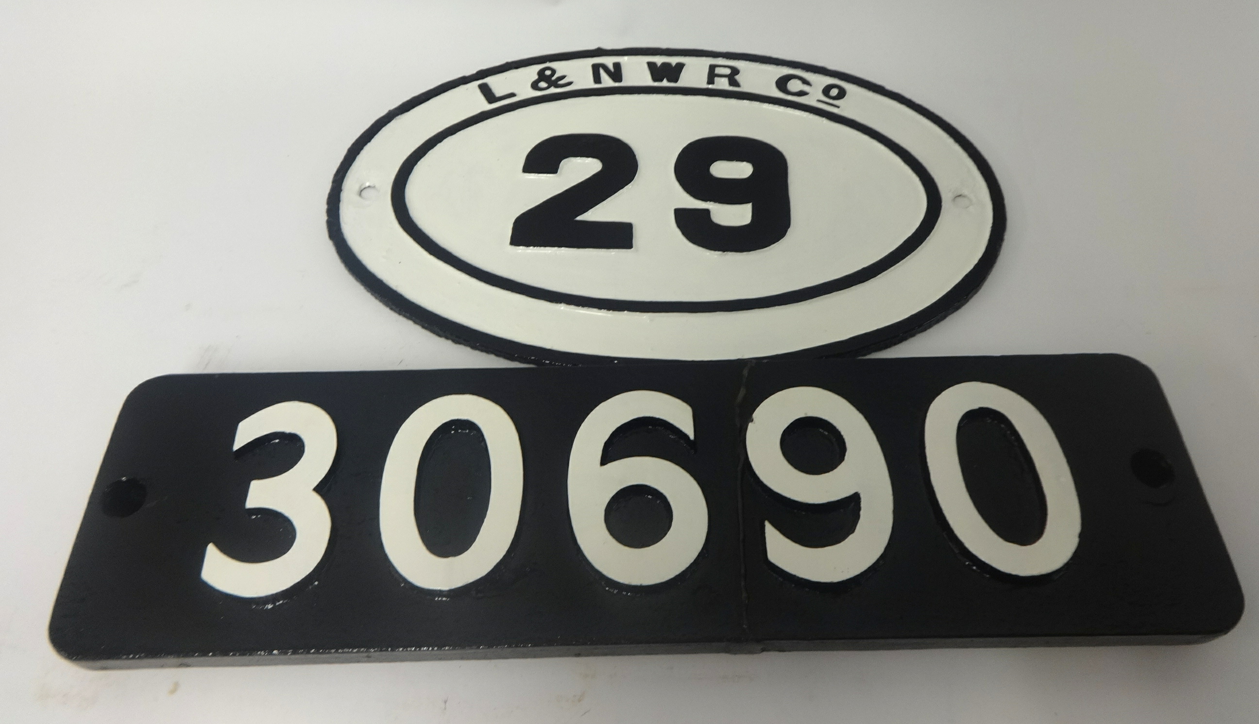 A rectangular train number plate 30690, width 56cm, glued together ...