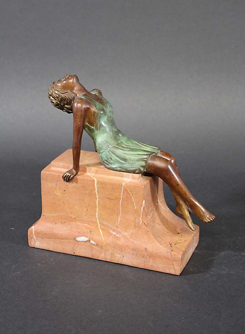 ART DECO BRONZE LADY a bronze figure of a reclining Lady, mounted on a ...