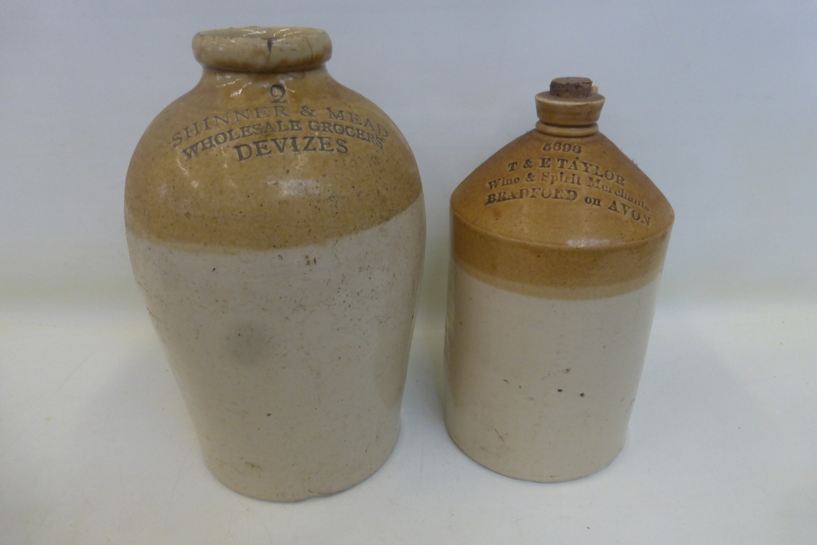 A large stoneware flagon for Skinner & Mead, Wholesale Grocers Devizes ...