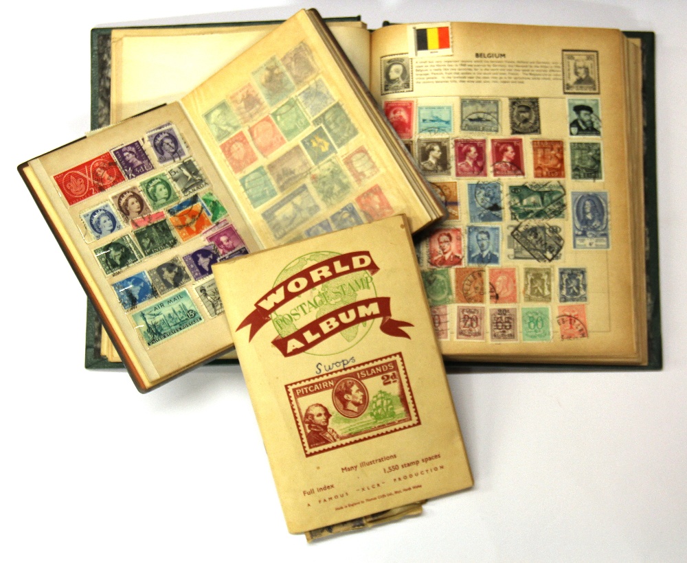 Three old stamp albums.
