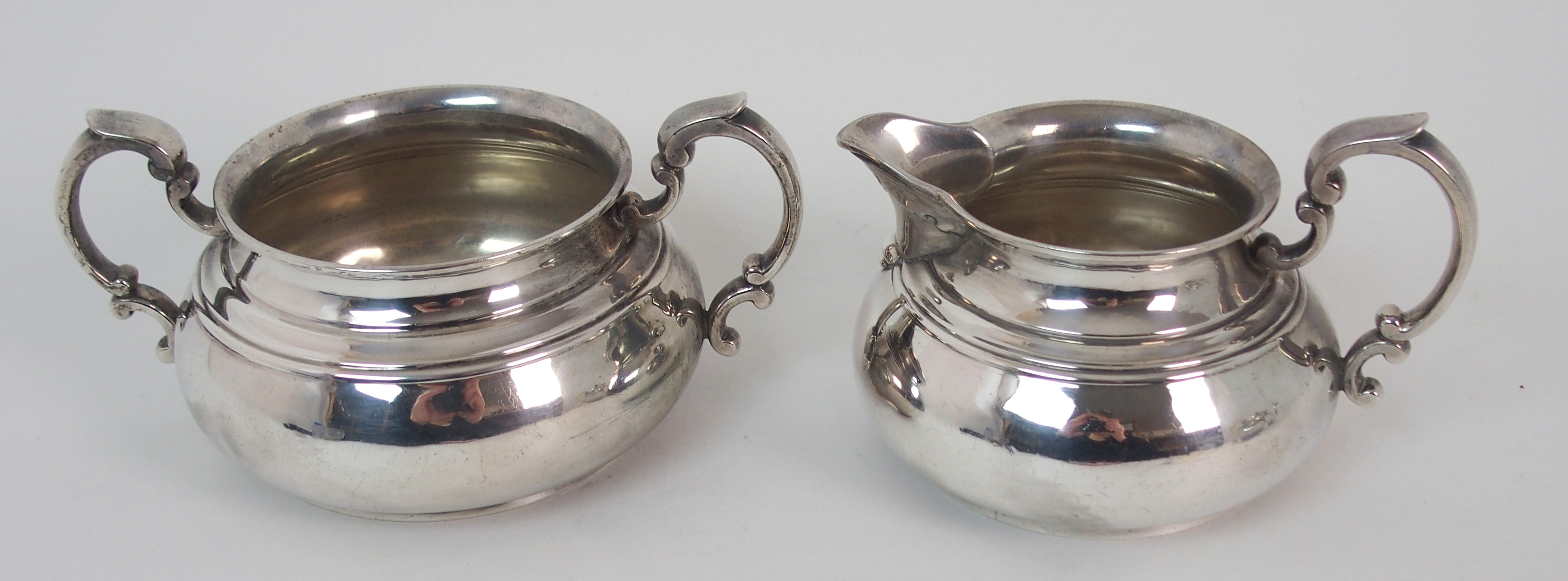 A three piece silver tea service by the Goldsmiths and Silversmiths ...