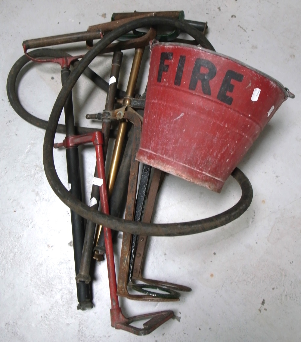 Four WWII stirrup pumps and a fire bucket (5).