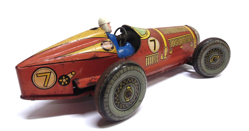 A METTOY TINPLATE RACING CAR yellow and red, racing number '7', with a ...