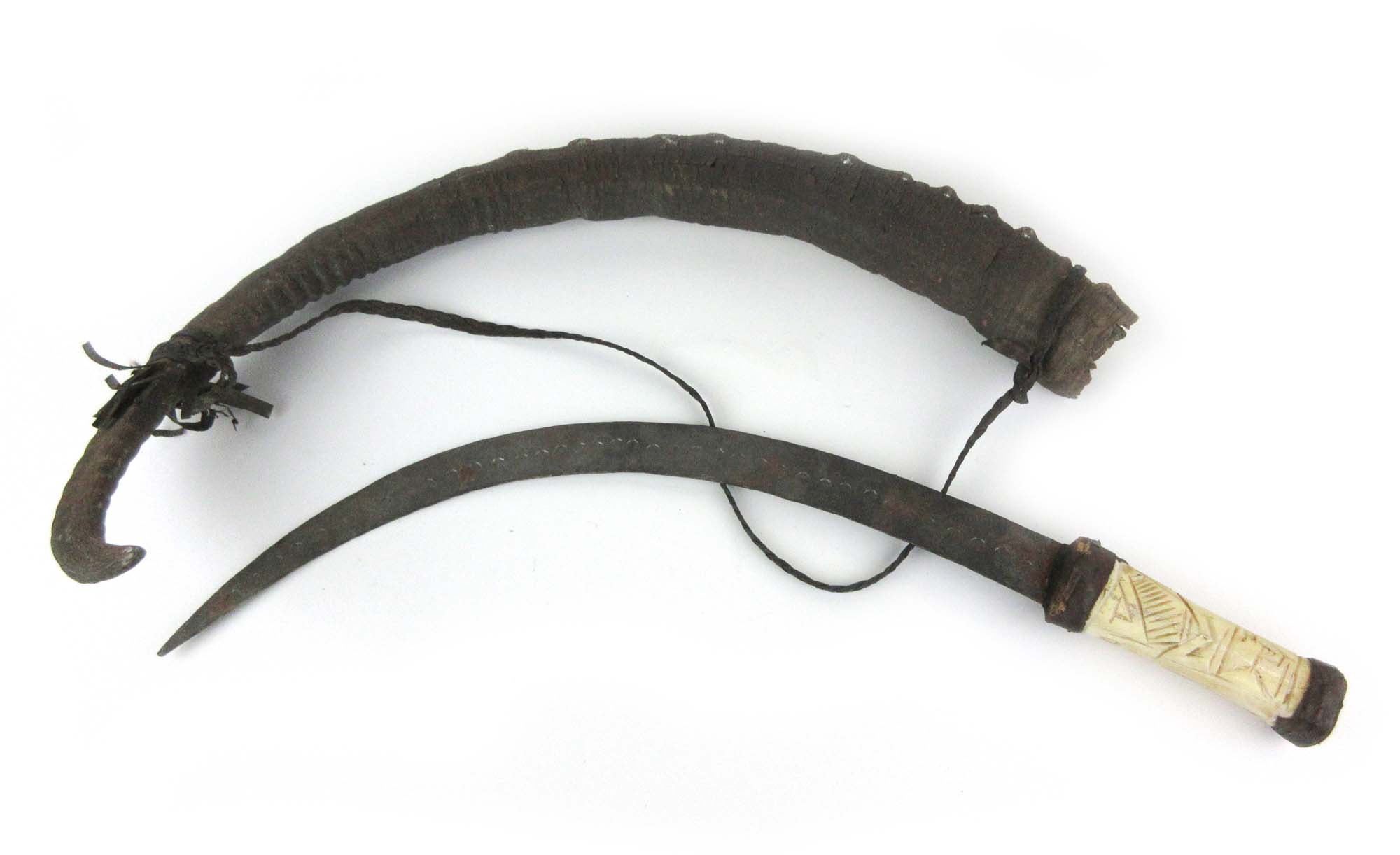 A 18th/19th century Ethiopian Shotel sword, with a curved engraved ...