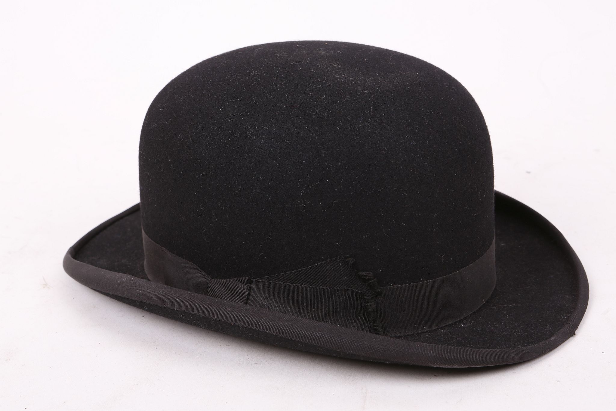 A vintage black bowler hat, by Woodrow, Piccadilly, London, size 7.