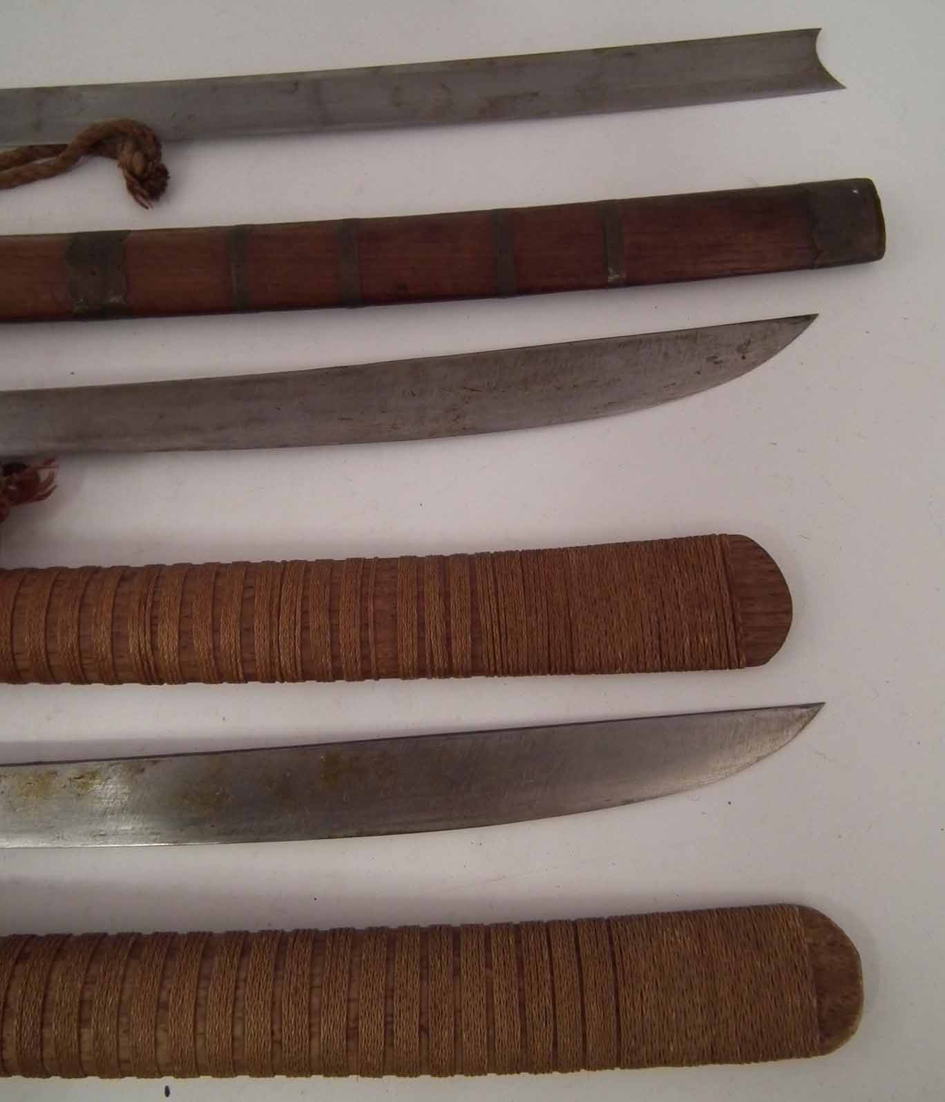 Two Burmese Dha/Dao and a Kachin Dha sword, with wood fittings bound in ...