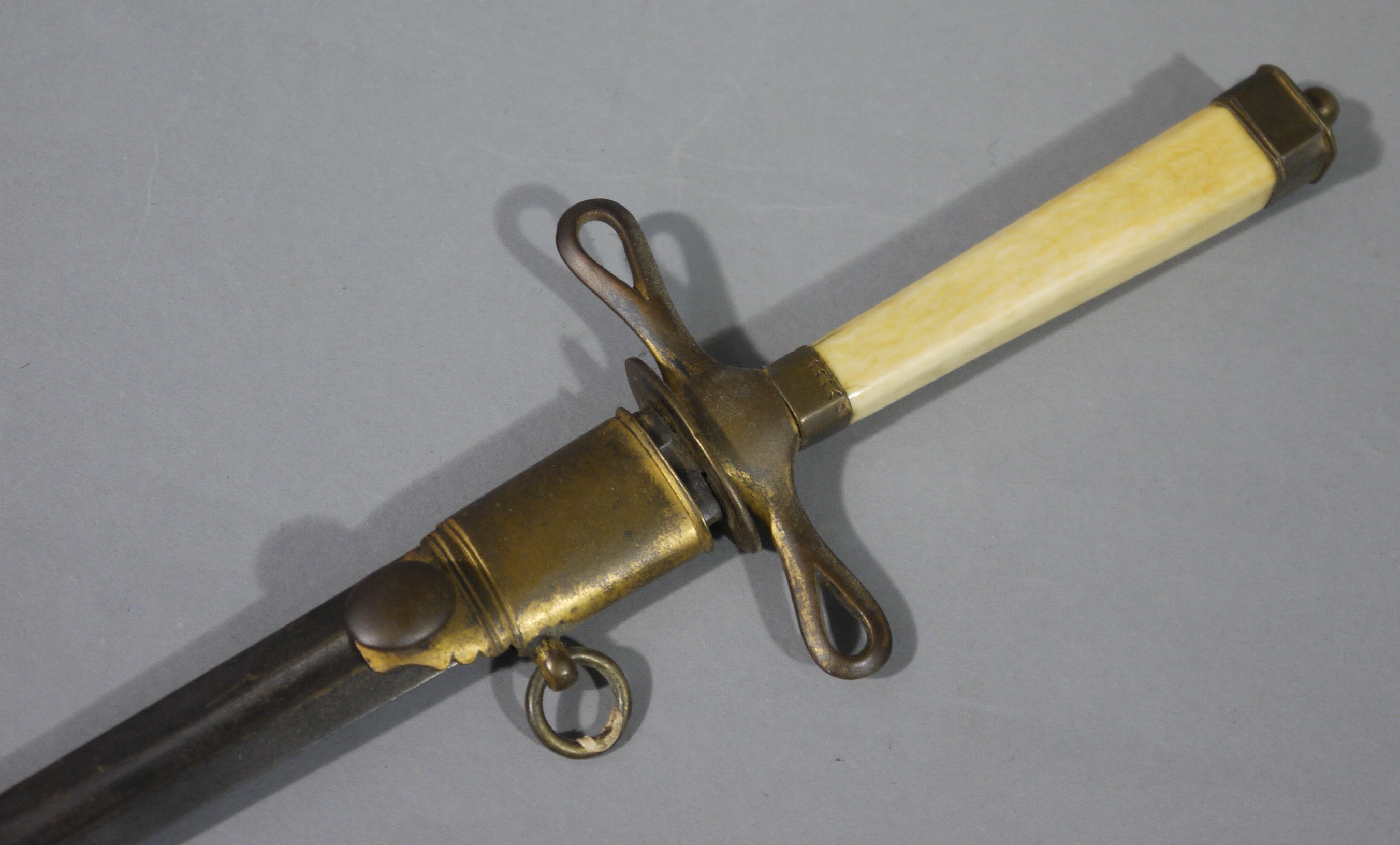 A small dress sword with tapered ivory handle, gilt metal ferrule ...