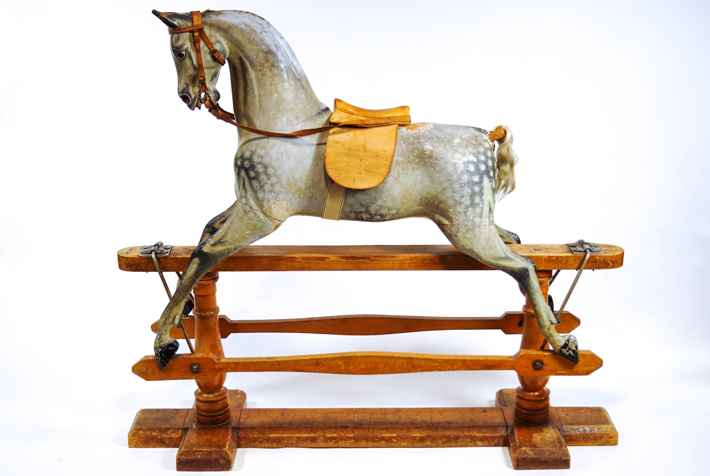 An early 20th Century carved and painted rocking horse by F H Ayres ...