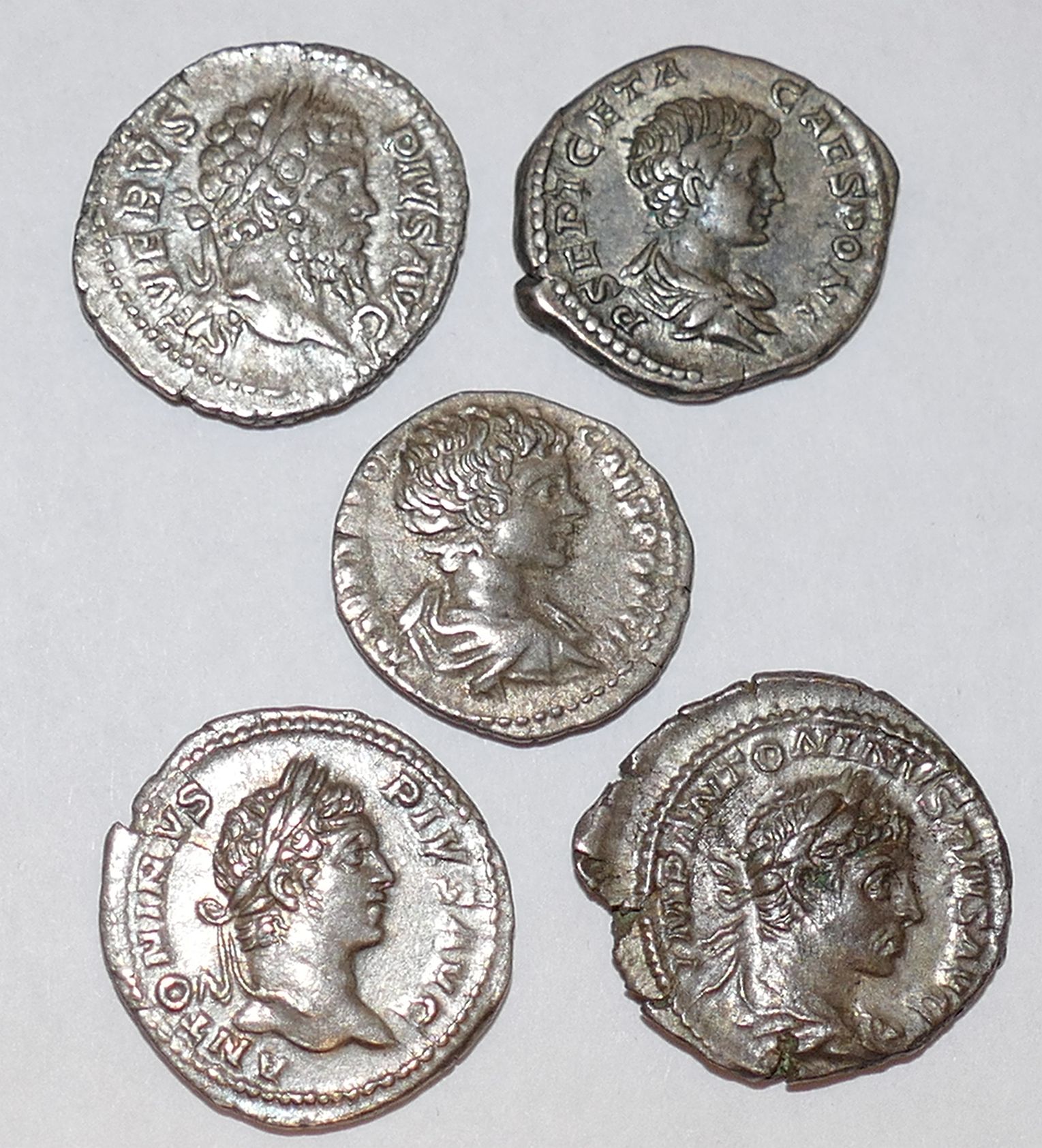 Five Roman silver coins including examples from the reigns of Septimus ...