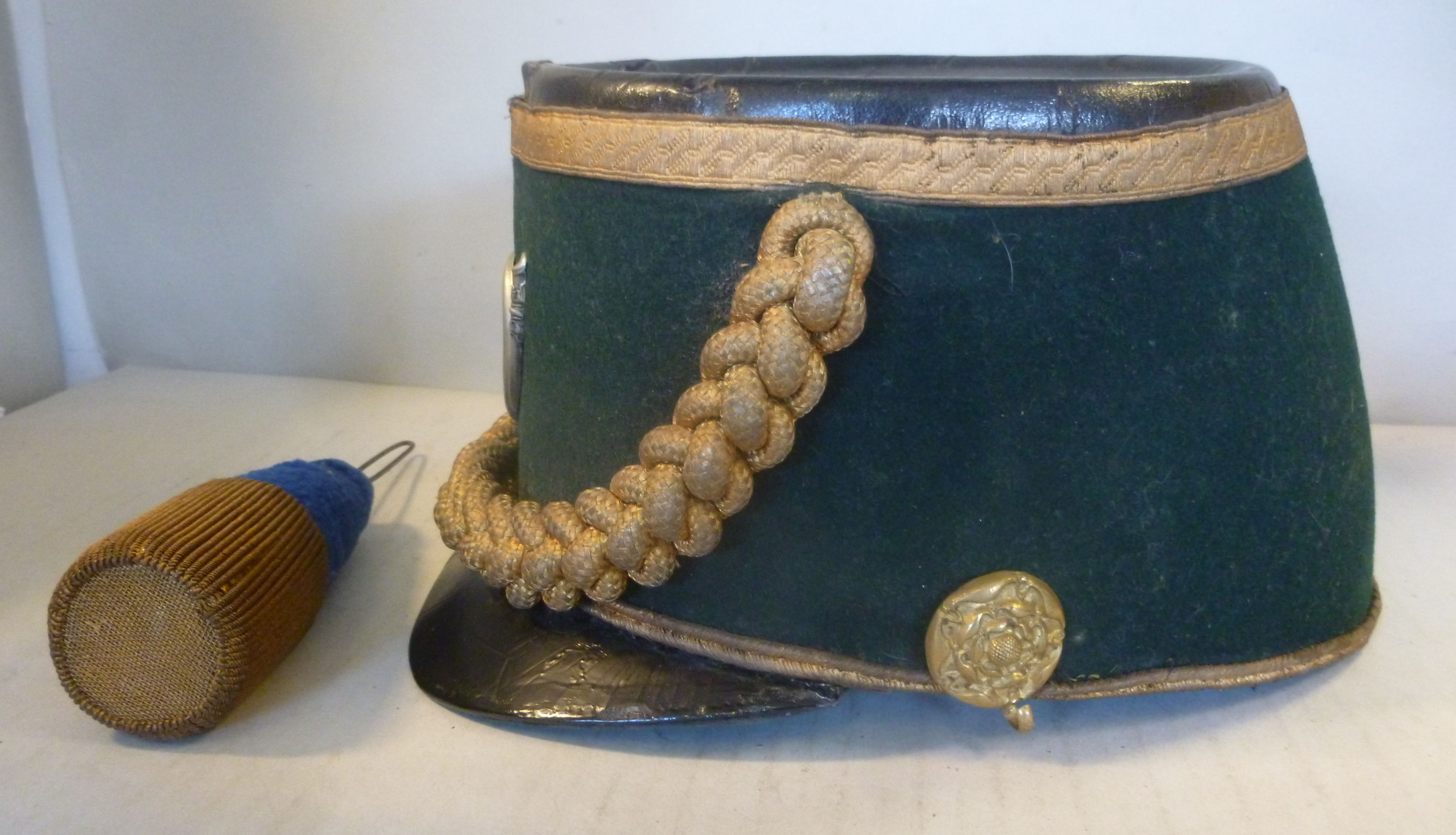 A 19thC style military shako, in a black painted tinplate box