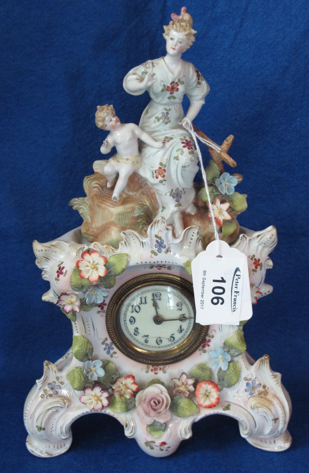 German porcelain figural mantle clock with painted and applied floral ...
