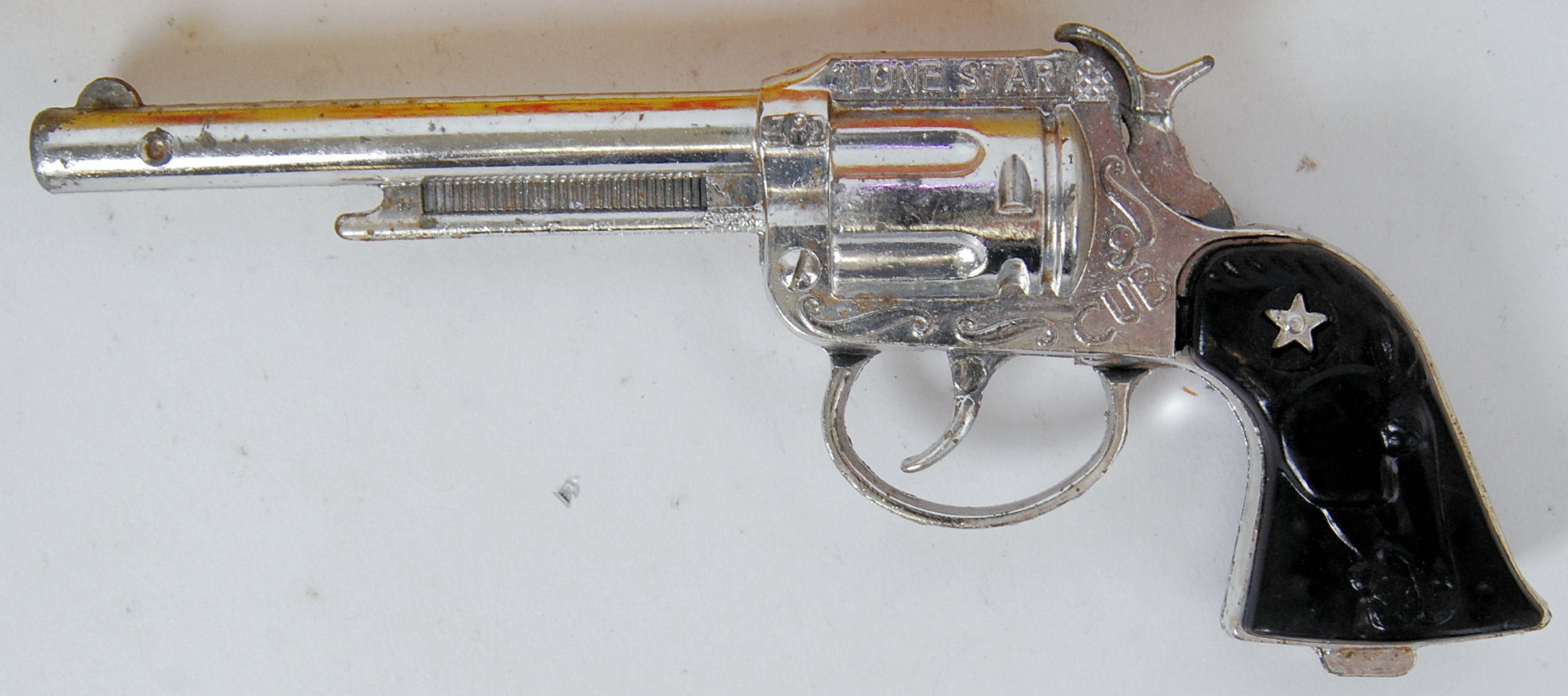 An original vintage Lone Star made ' Cub ' cap gun. Within the original ...