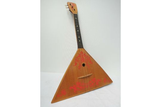 A triangular shaped three string mandolin of mid 20thC construction.