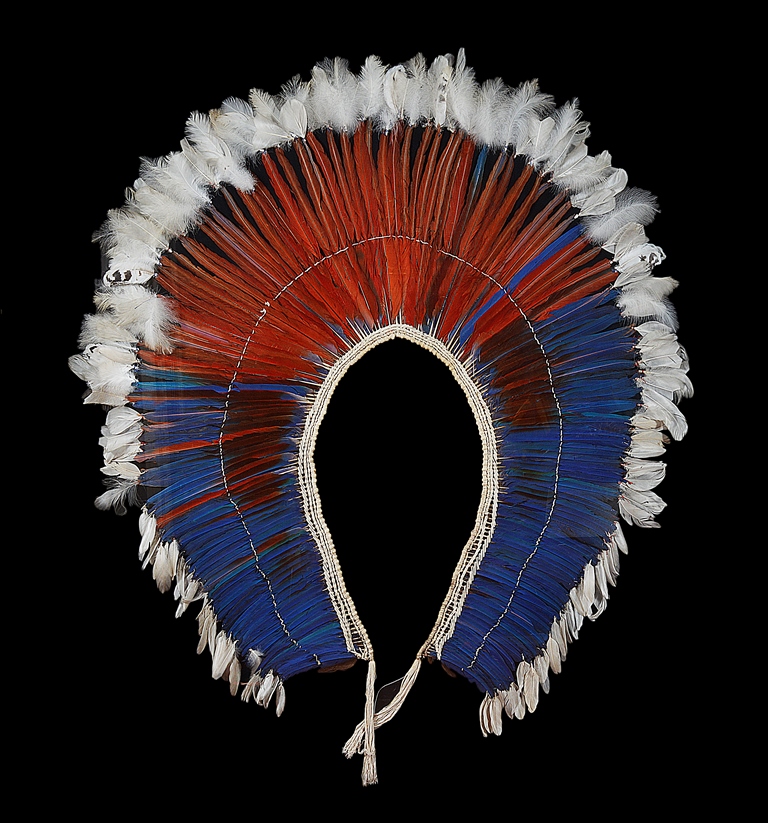 A Brazilian Kayapo Tribe Feather Headdress:Framed and glazed, the arc ...